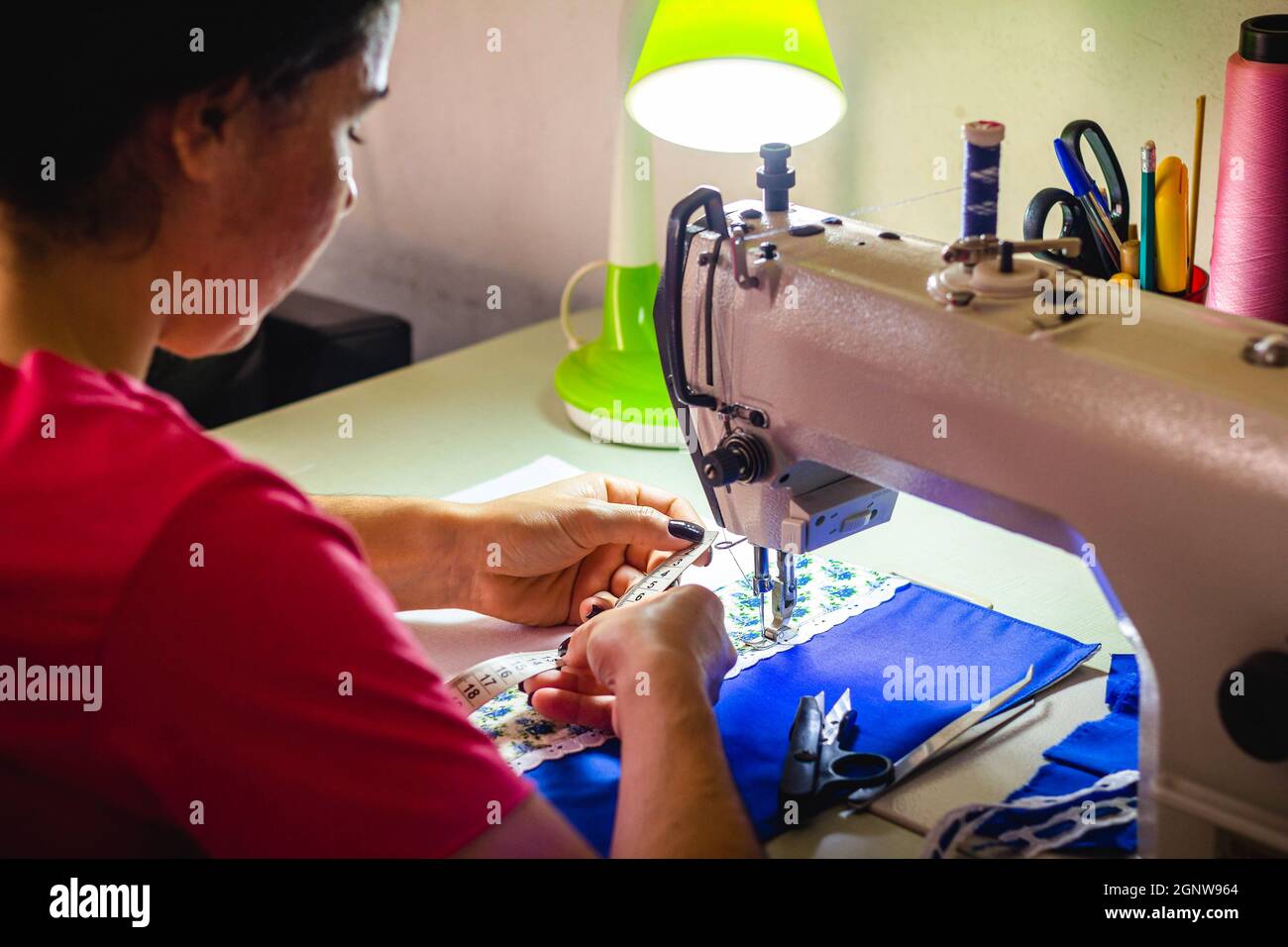 Brazil. 26th Sep, 2021. In this photo illustration a seamstress working ...