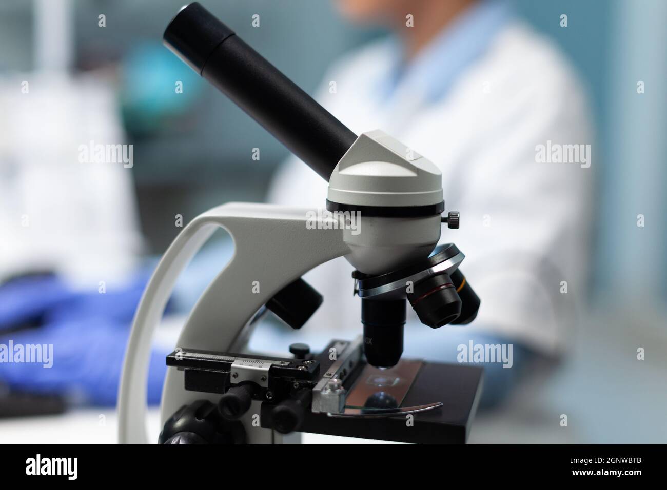 Selective focus on medical microscope standing on table in biochemistry ...