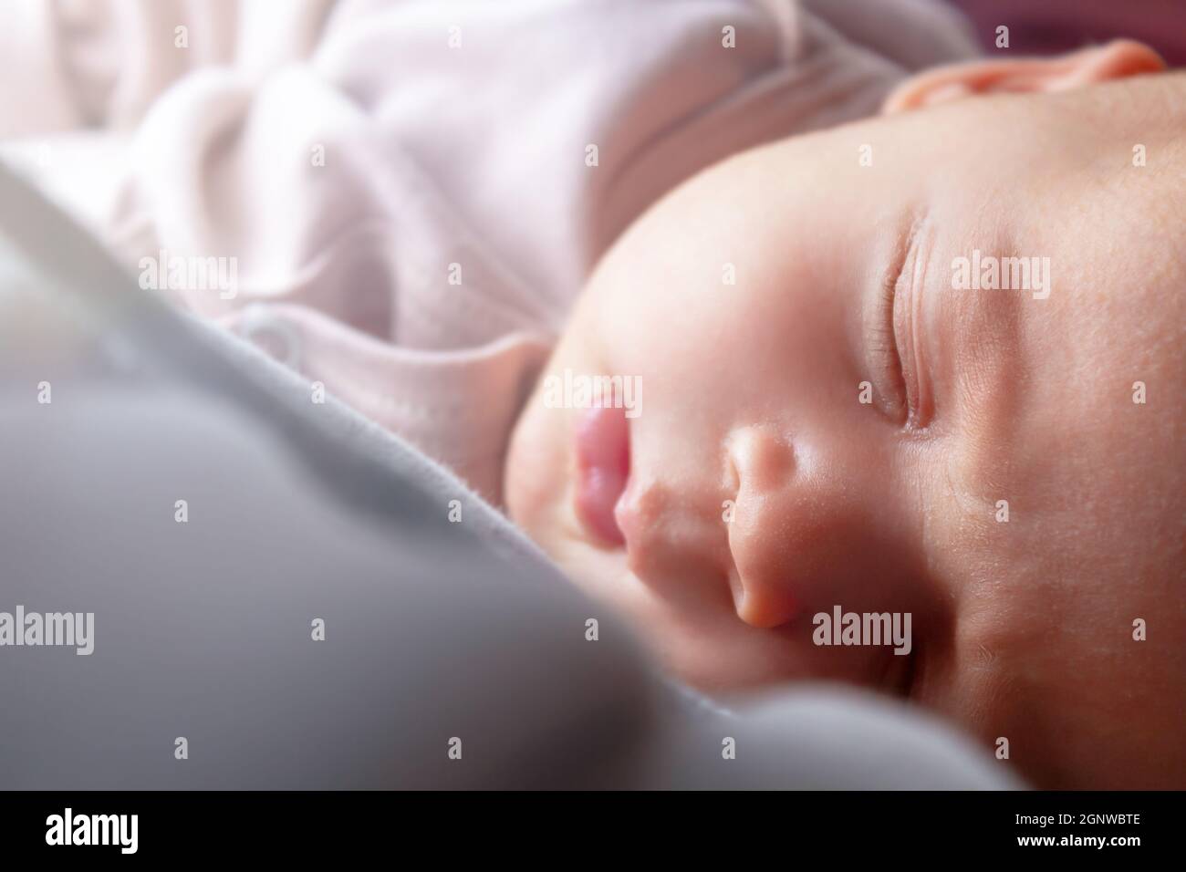 Mother holding baby in hands. Top view Stock Photo - Alamy