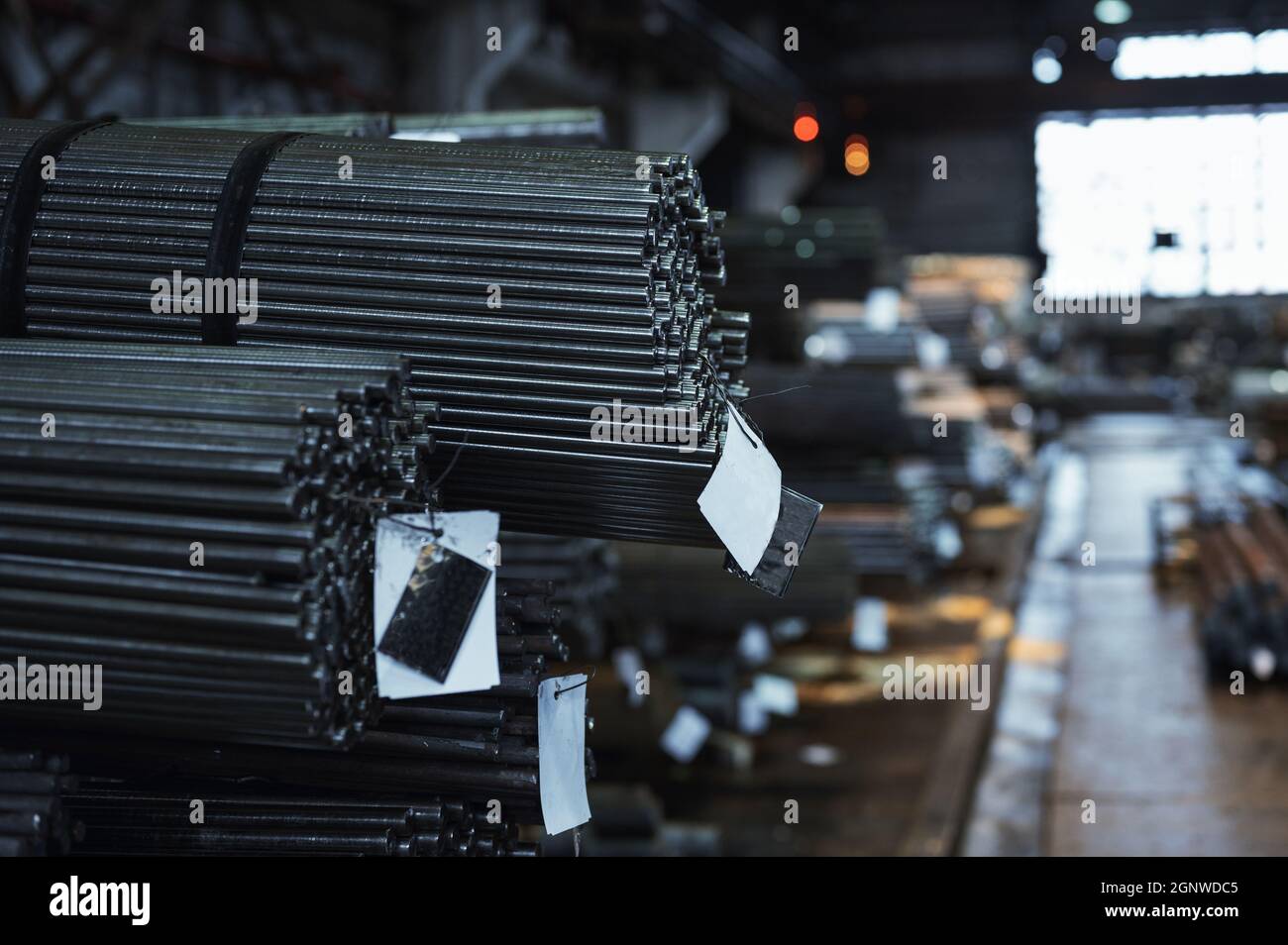 A bundle of round metal bars, steel mill products Stock Photo - Alamy