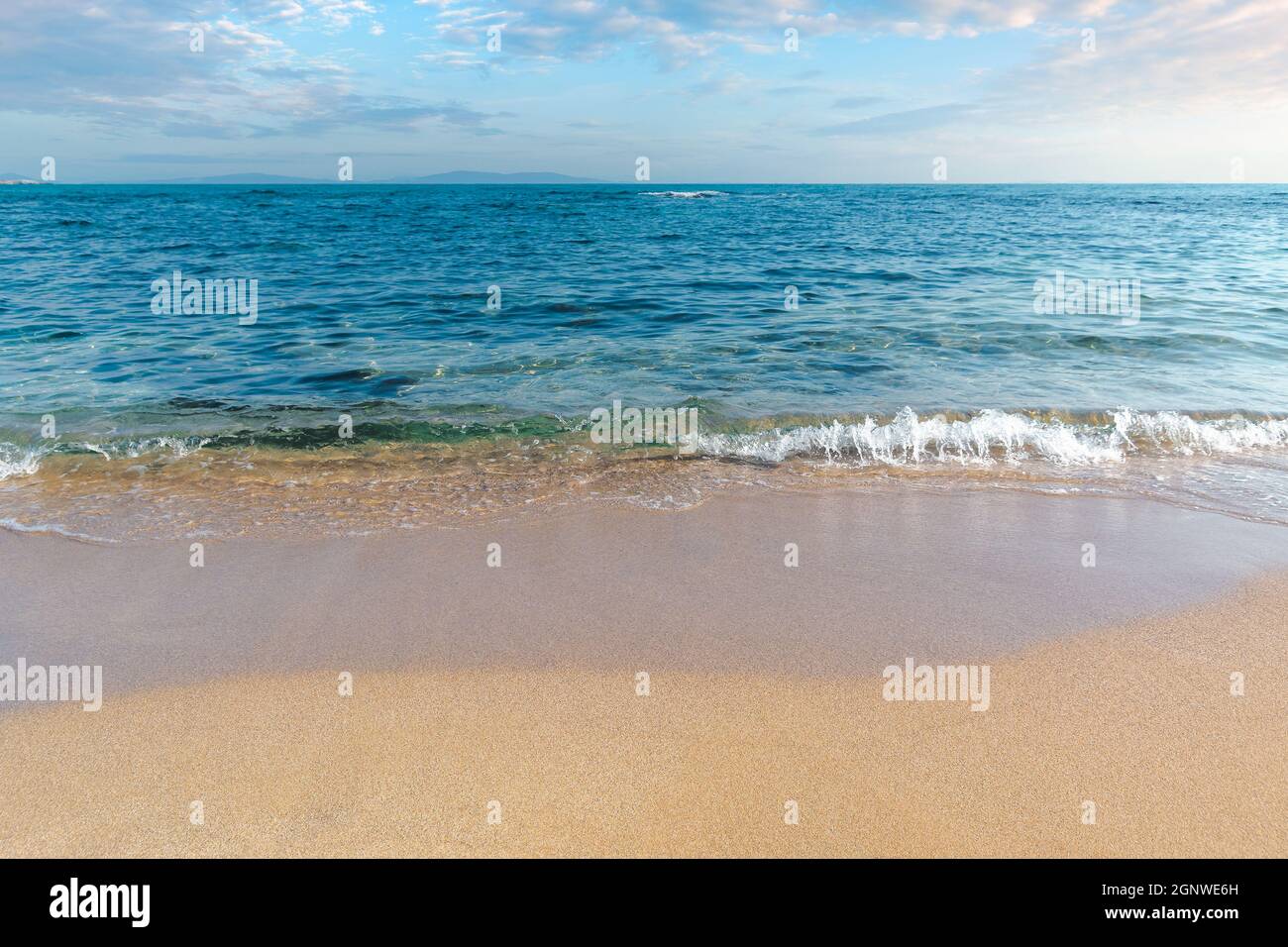 calm morning scenery at the sea. empty sandy beach in morning light ...