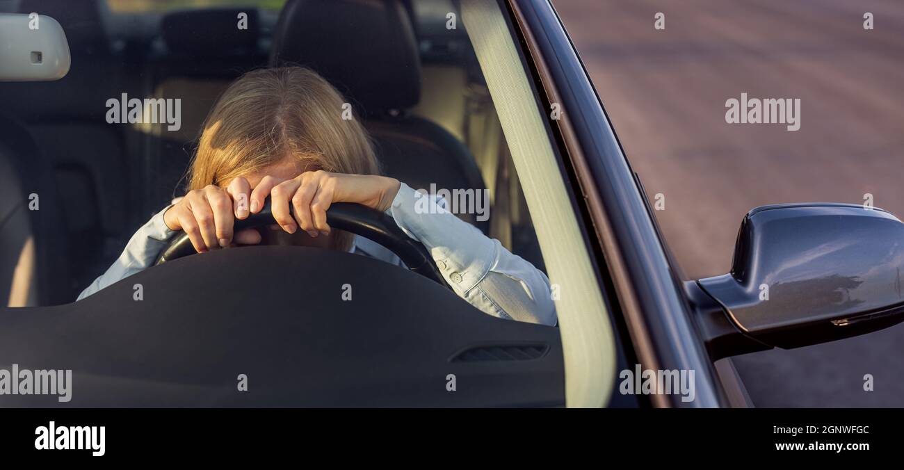 Woman tired after driving car Stock Photo - Alamy