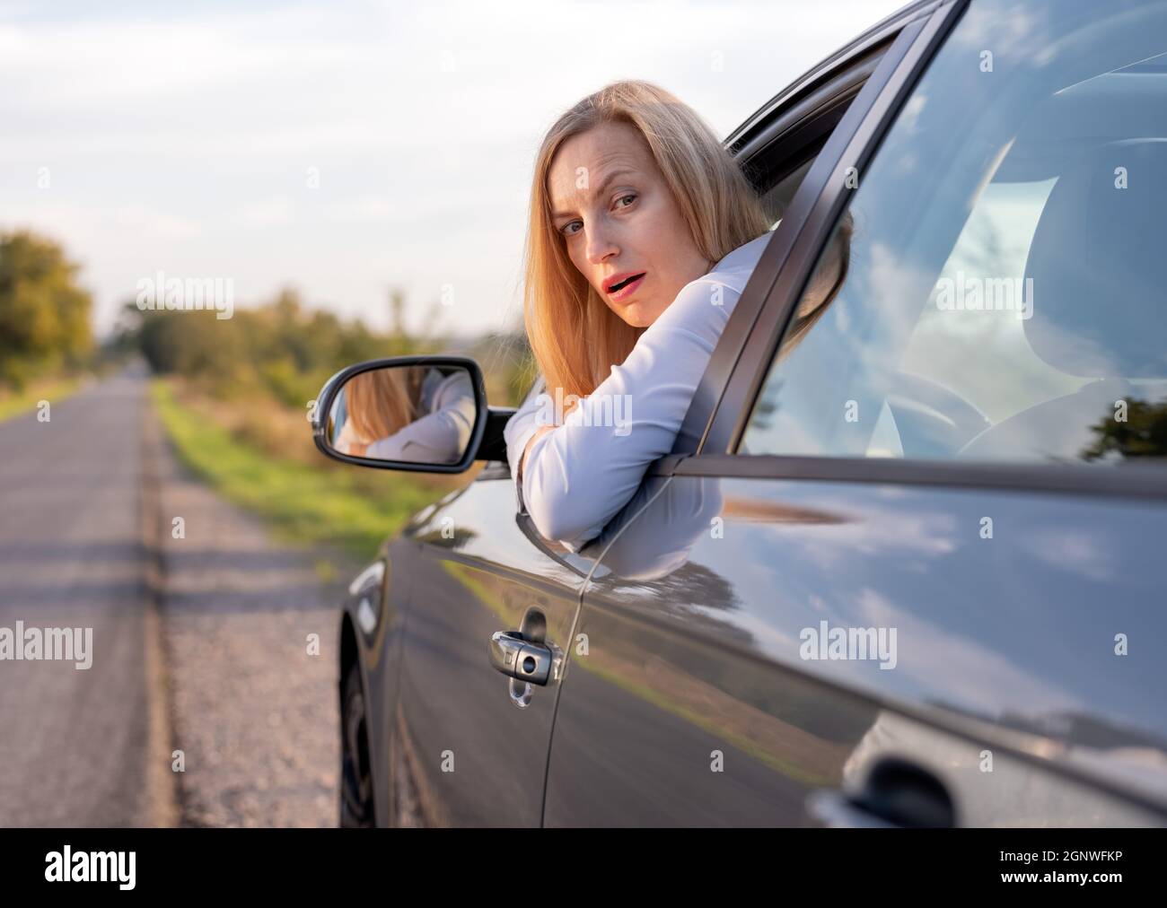 Shocked woman in car Stock Photo - Alamy