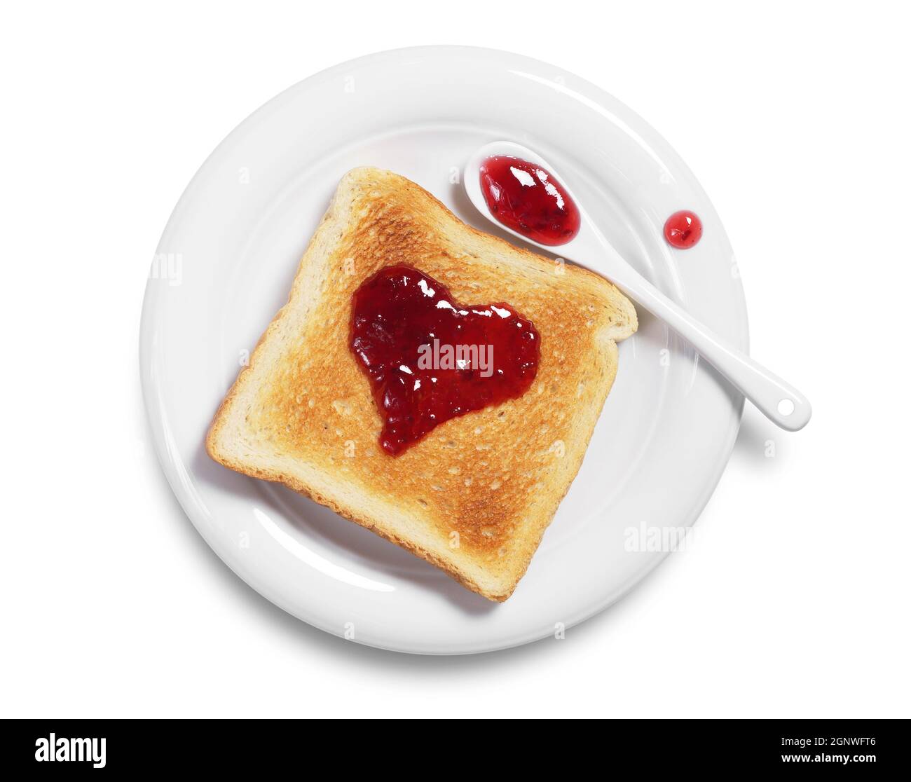 Toasted bread with raspberry jam in the shape of heart in plate on ...