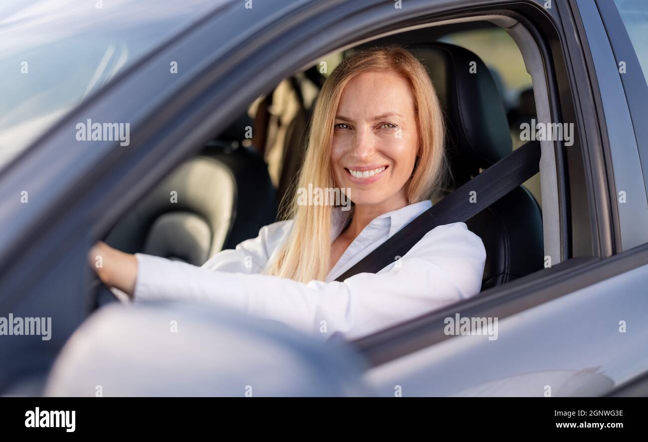 Portrait of woman in car Stock Photo - Alamy