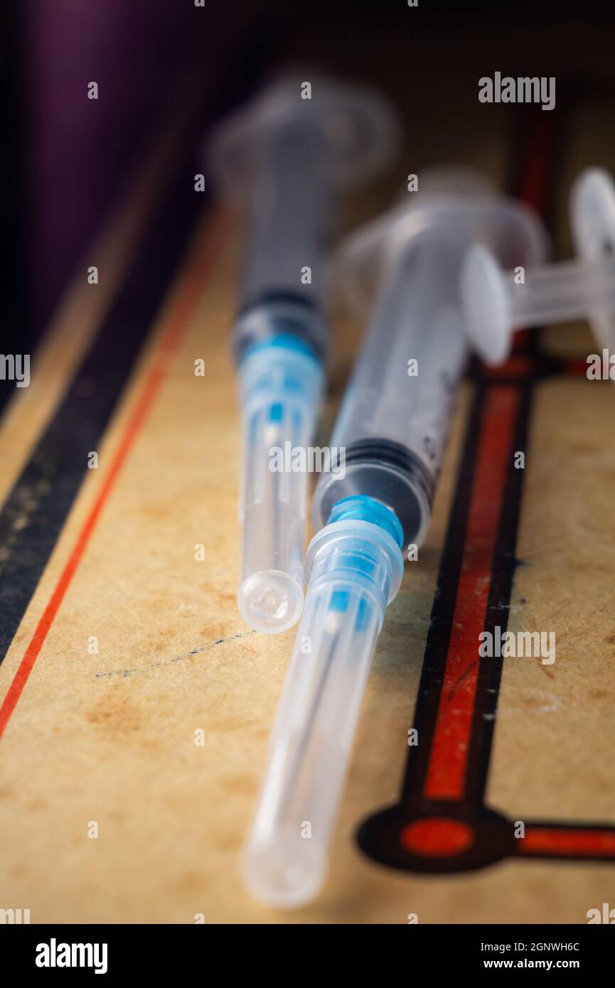 Close-up shot of disposal injection syringes - perfect for a ...