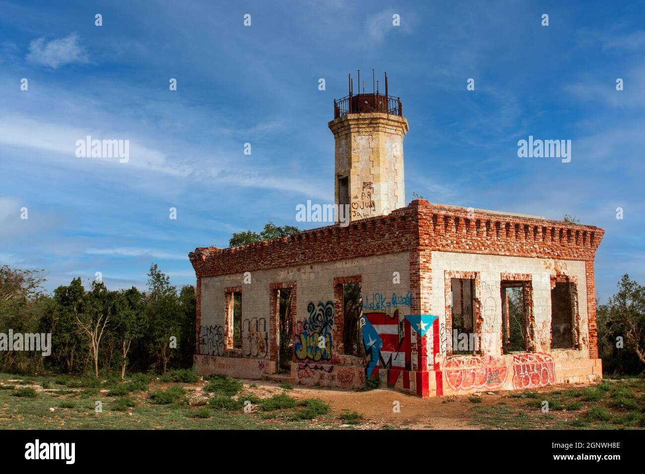 Old lighthouse Guanica with graffitis under a blue sky in the Puerto ...