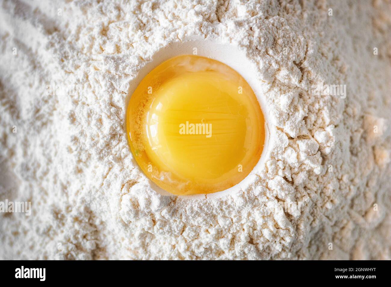 chicken yolk on flour close-up Stock Photo - Alamy