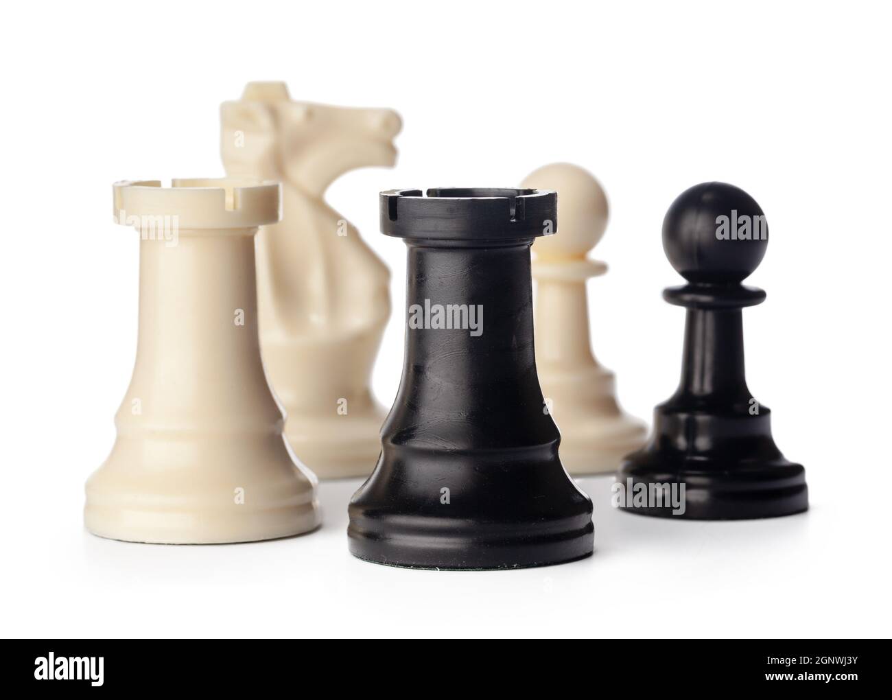 Black and white chess pieces on white background Stock Photo - Alamy