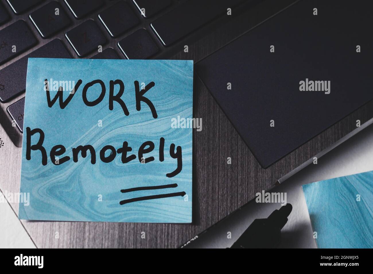 laptop and sticker with the inscription work remotely Stock Photo - Alamy