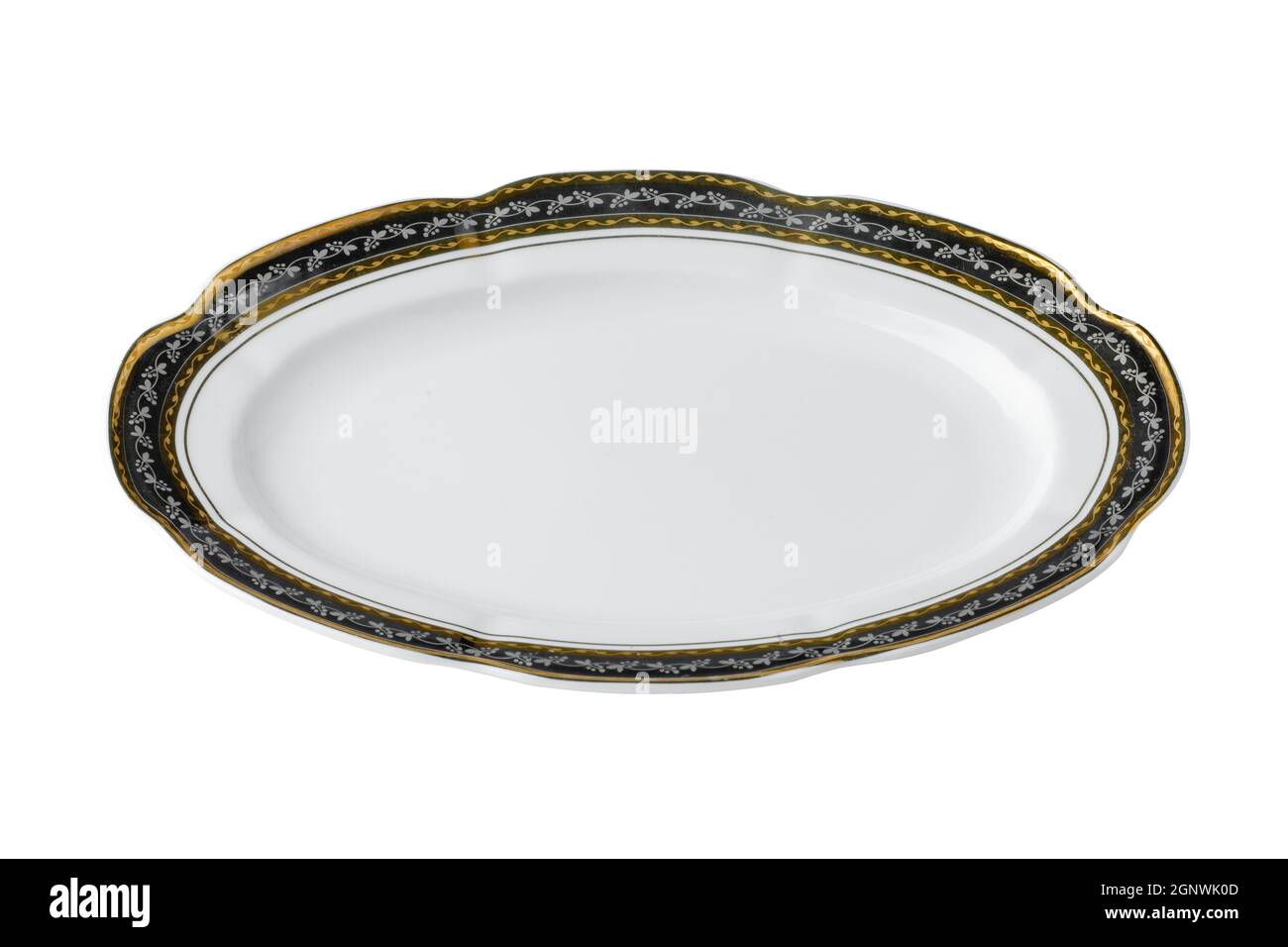 White ceramic table plate with golden border isolated on white ...