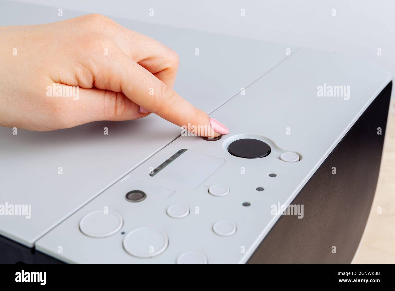 Hands of a woman using a copying machine close up Stock Photo - Alamy