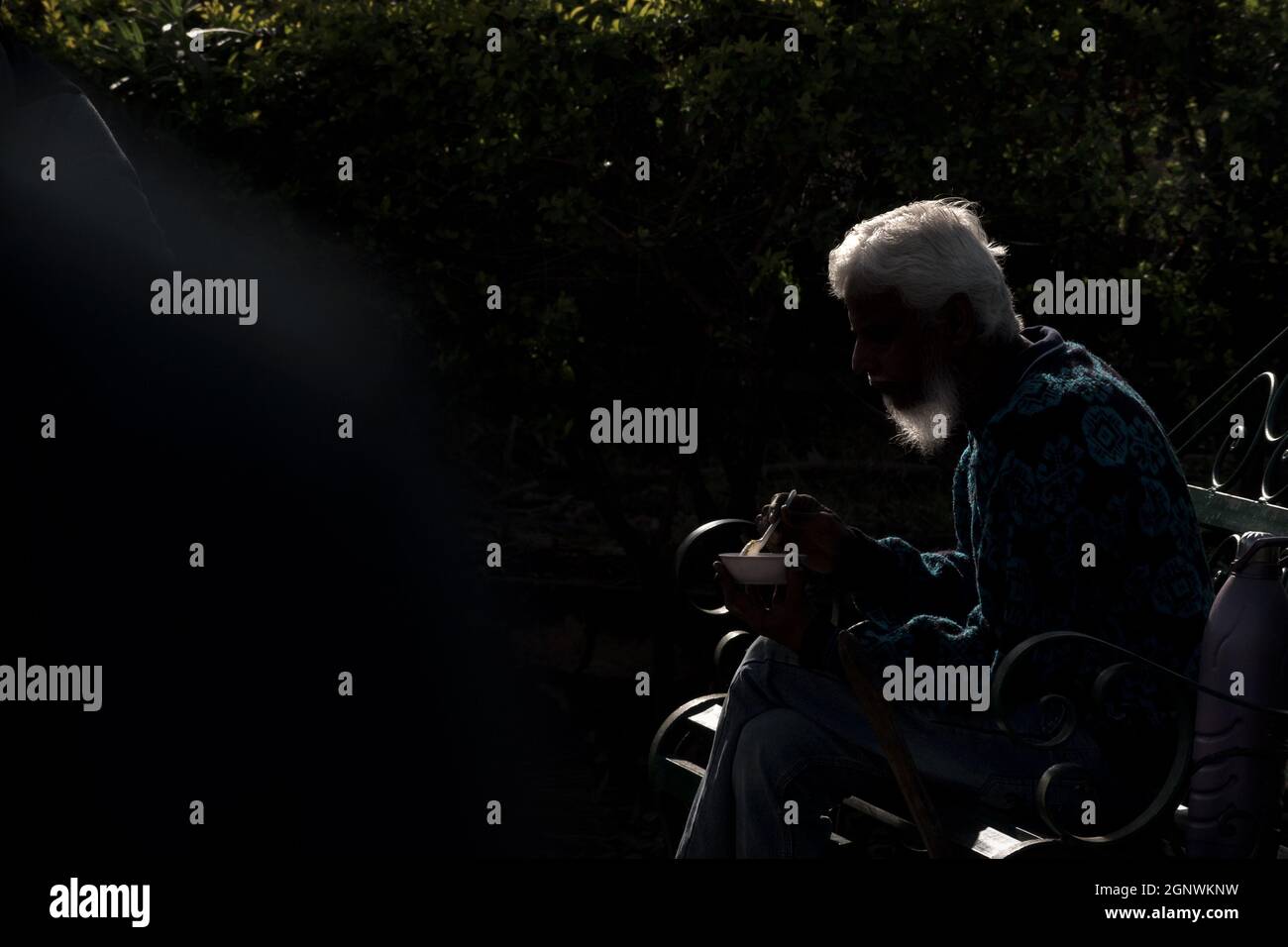 Street photograph of an old man with white hair and long beard with ...
