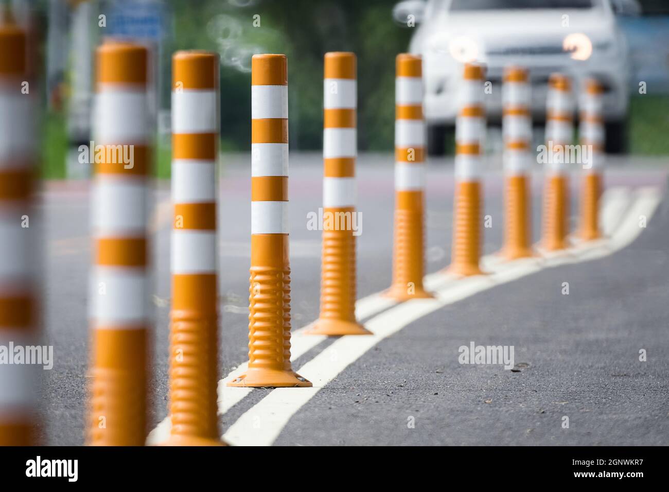 Flexible traffic bollard for bike lane Stock Photo - Alamy