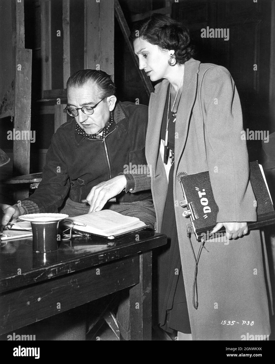 Director FRITZ LANG and Continuity Girl DOROTHY HUGHES on set candid ...