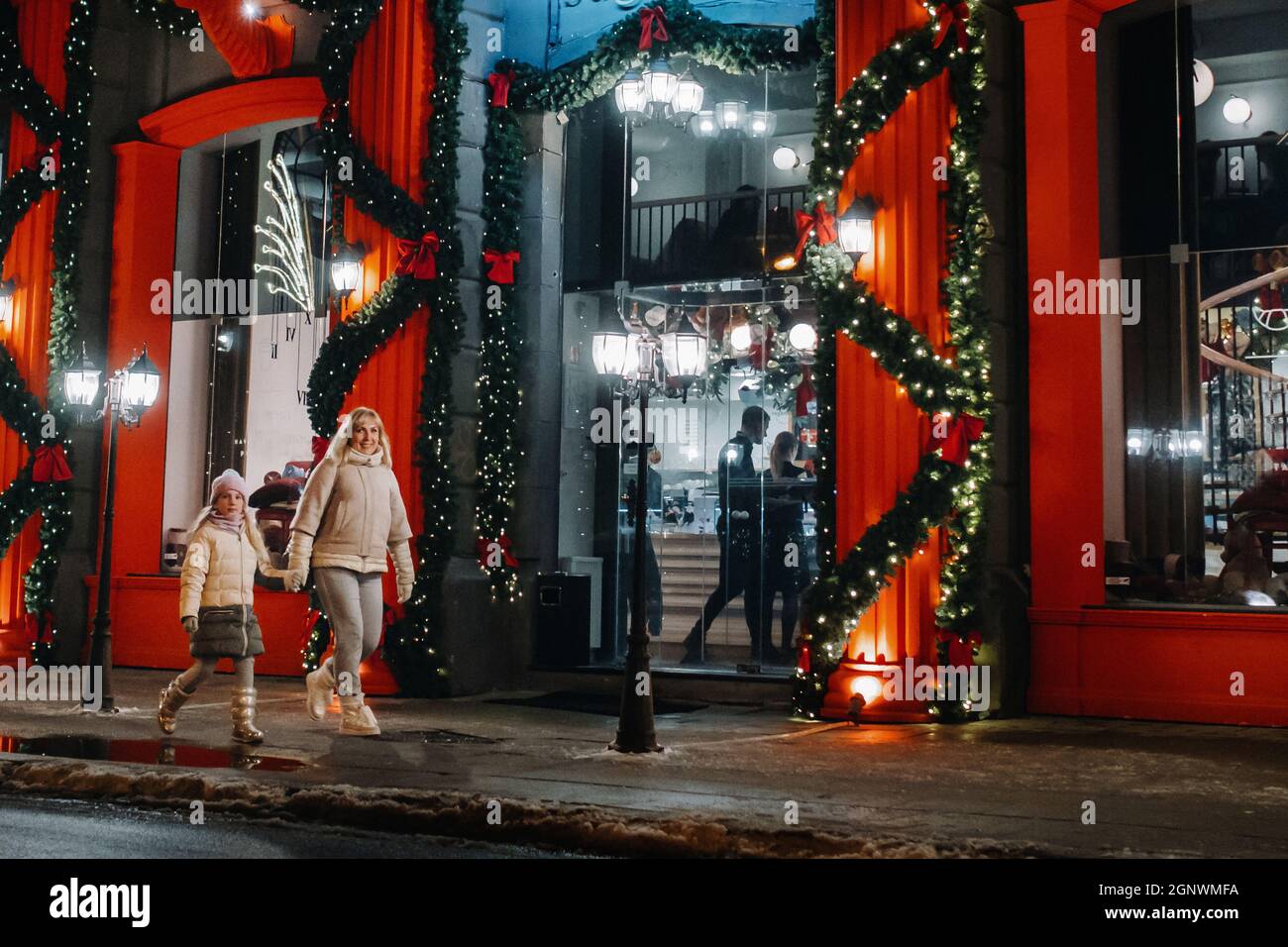 A family walks around the New Year's city of Vilnius.Lithuania Stock ...