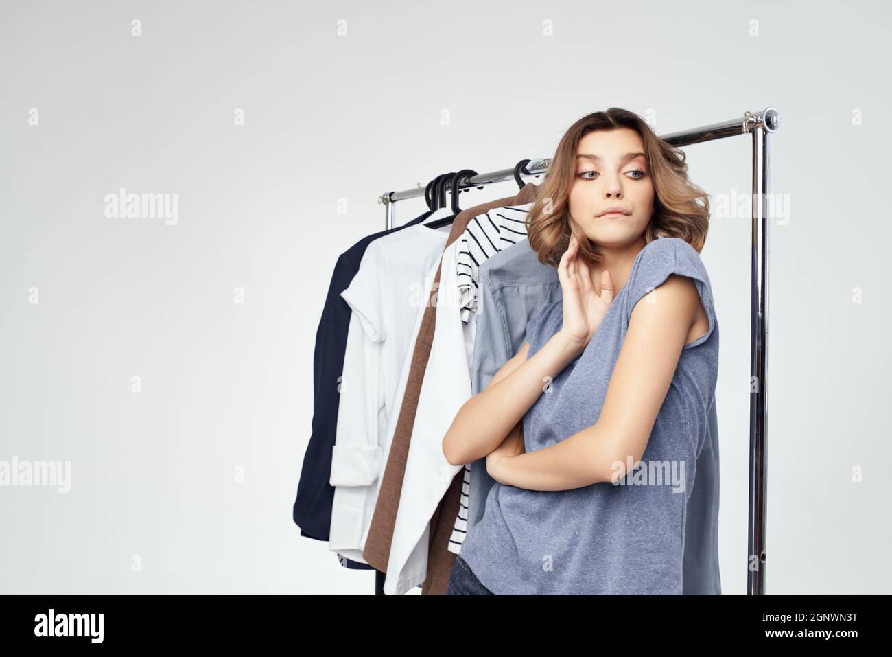 beautiful woman clothing store buyer sale light background Stock Photo ...