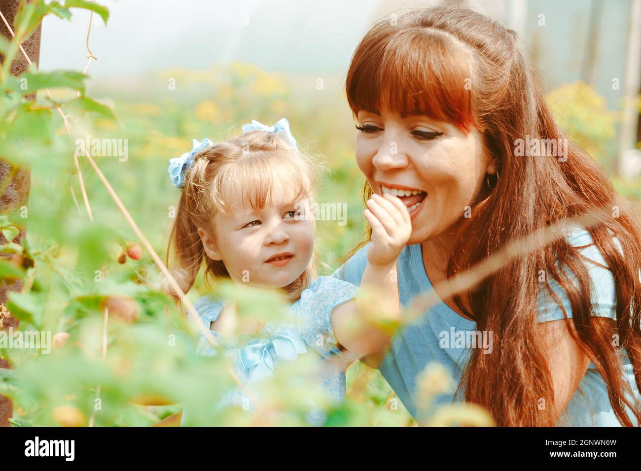 mom hugs her daughter in nature Stock Photo - Alamy