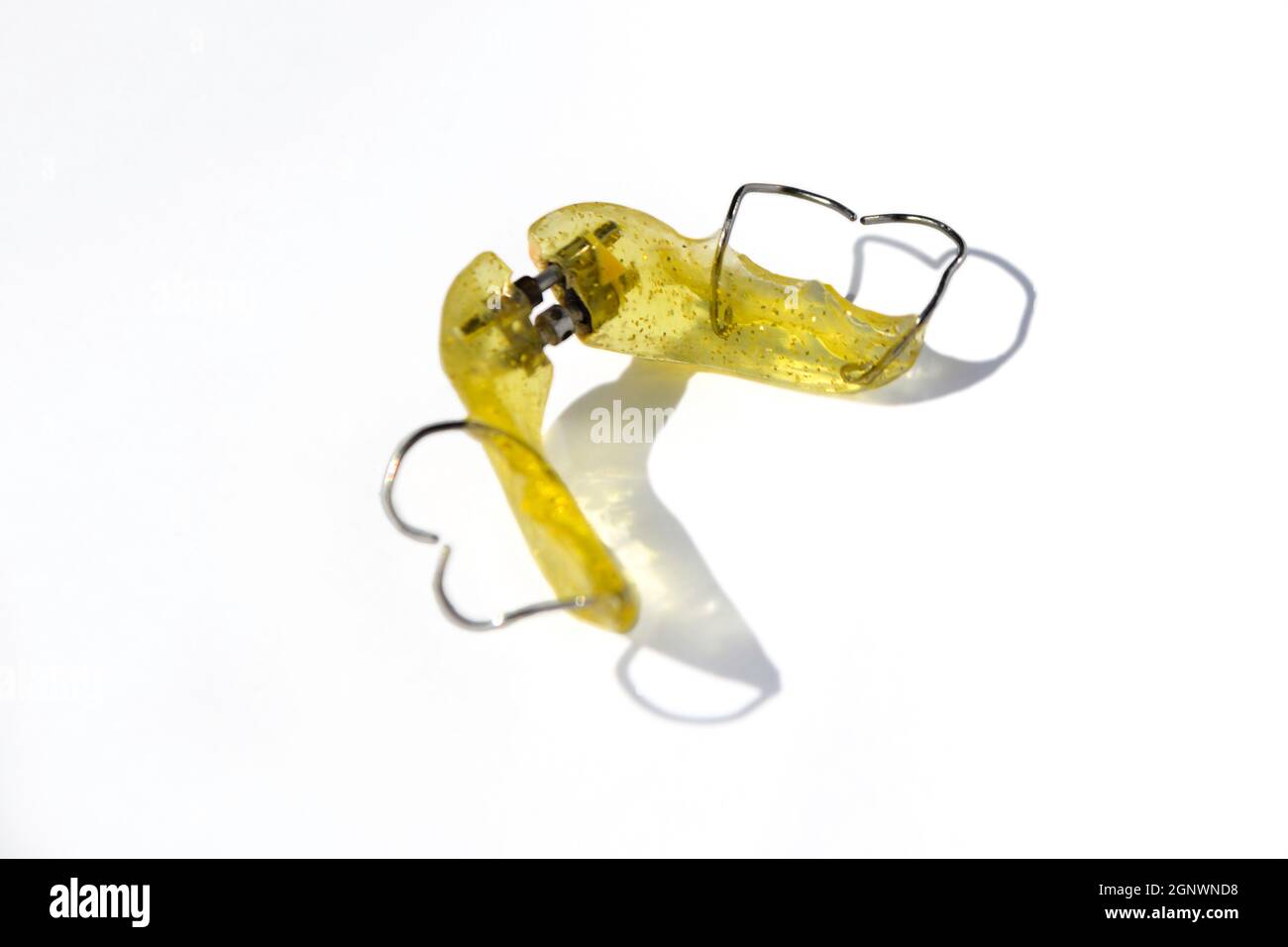 Close up of pink removable dental plate maxilla retainer isolated on ...