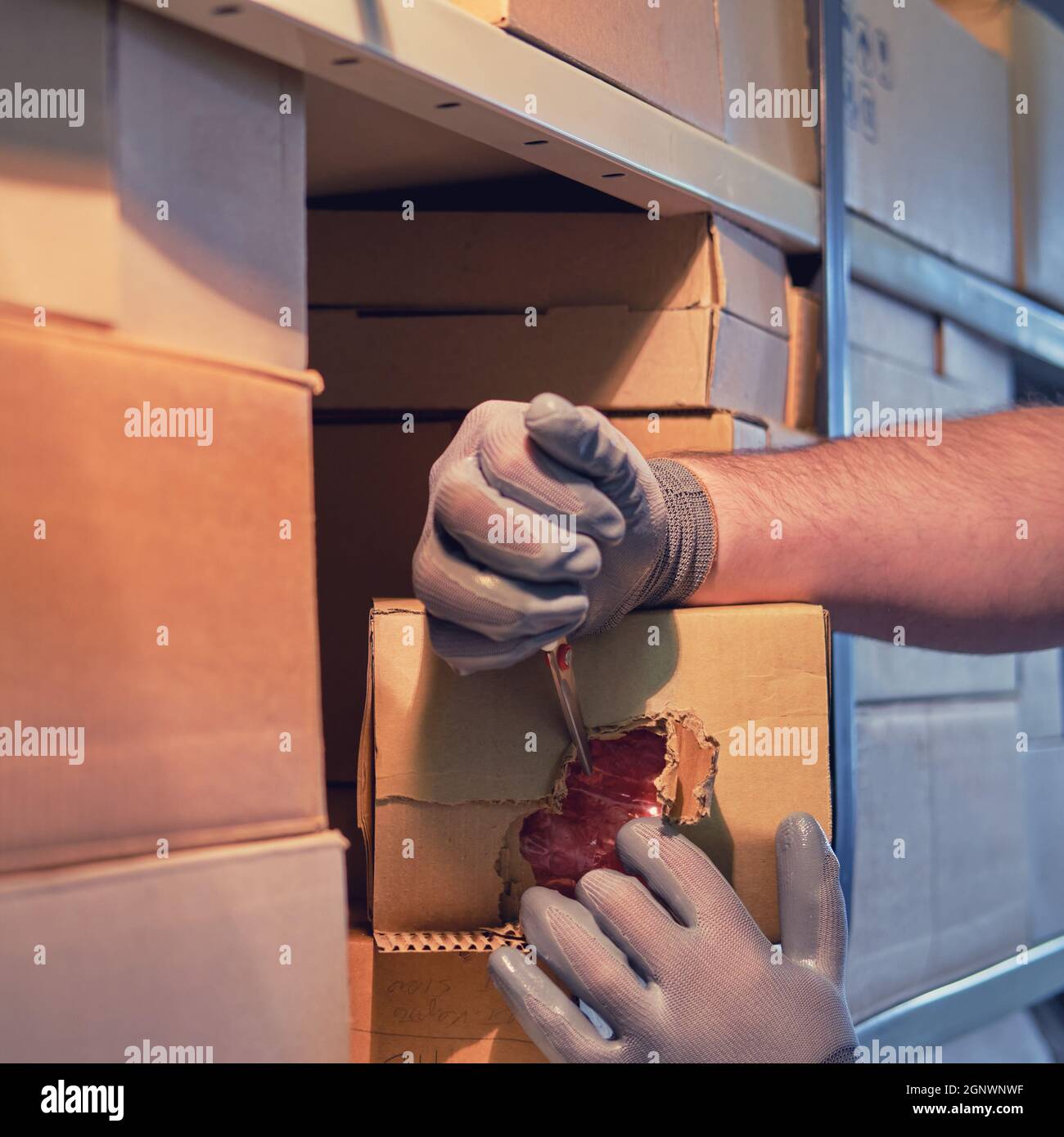 Stealing parcels and damaging the packaging of goods in the warehouse ...