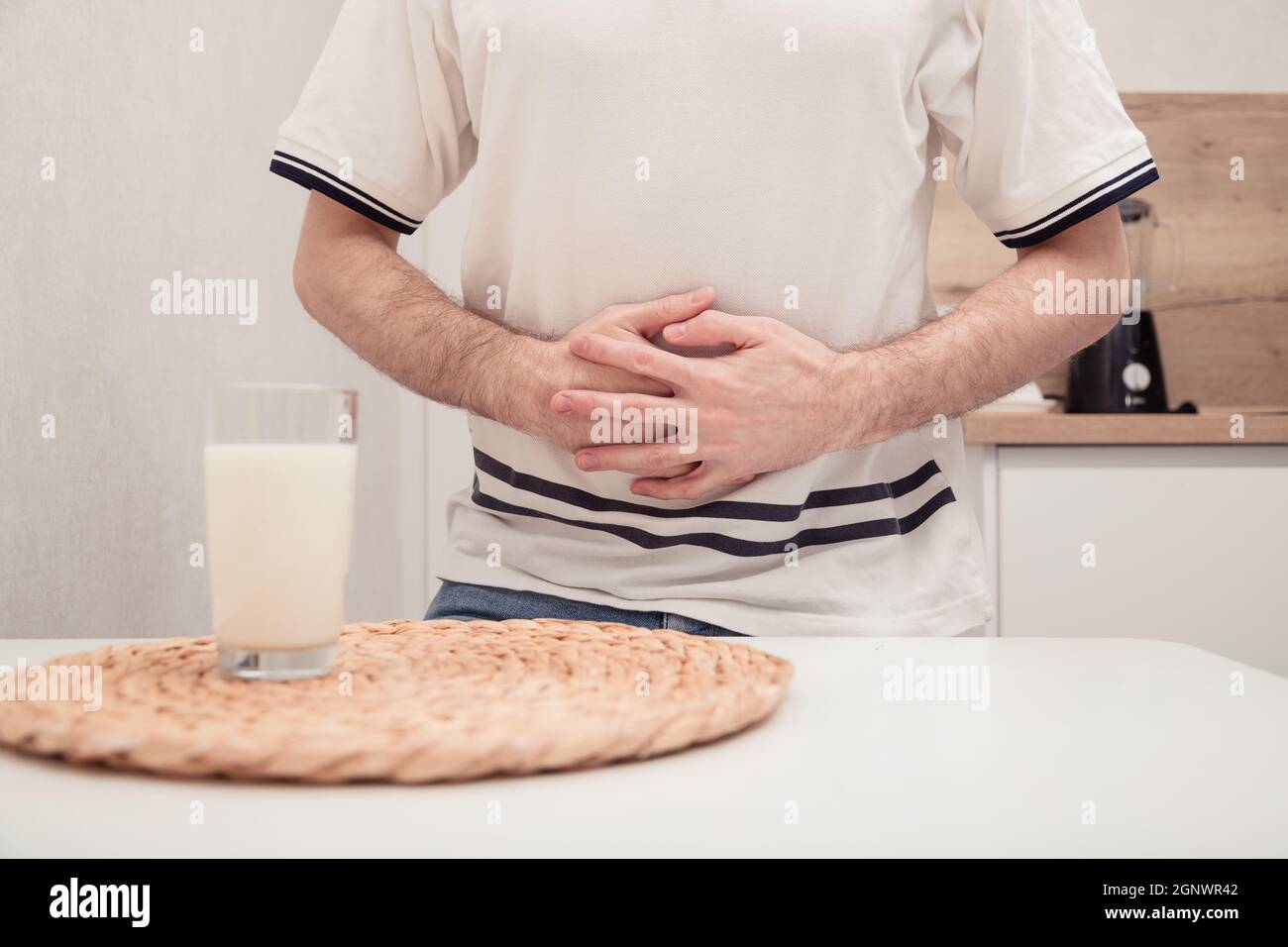 Man feels bad, lactose intolerance. Dairy intolerant person. Health ...