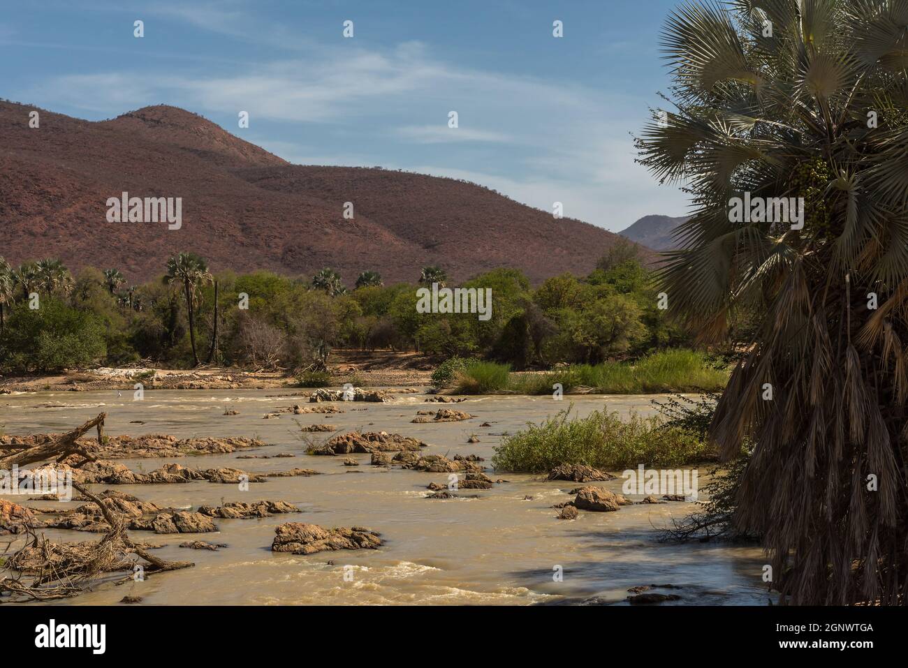 Landscape view of the Kunene River, the border river between Namibia ...