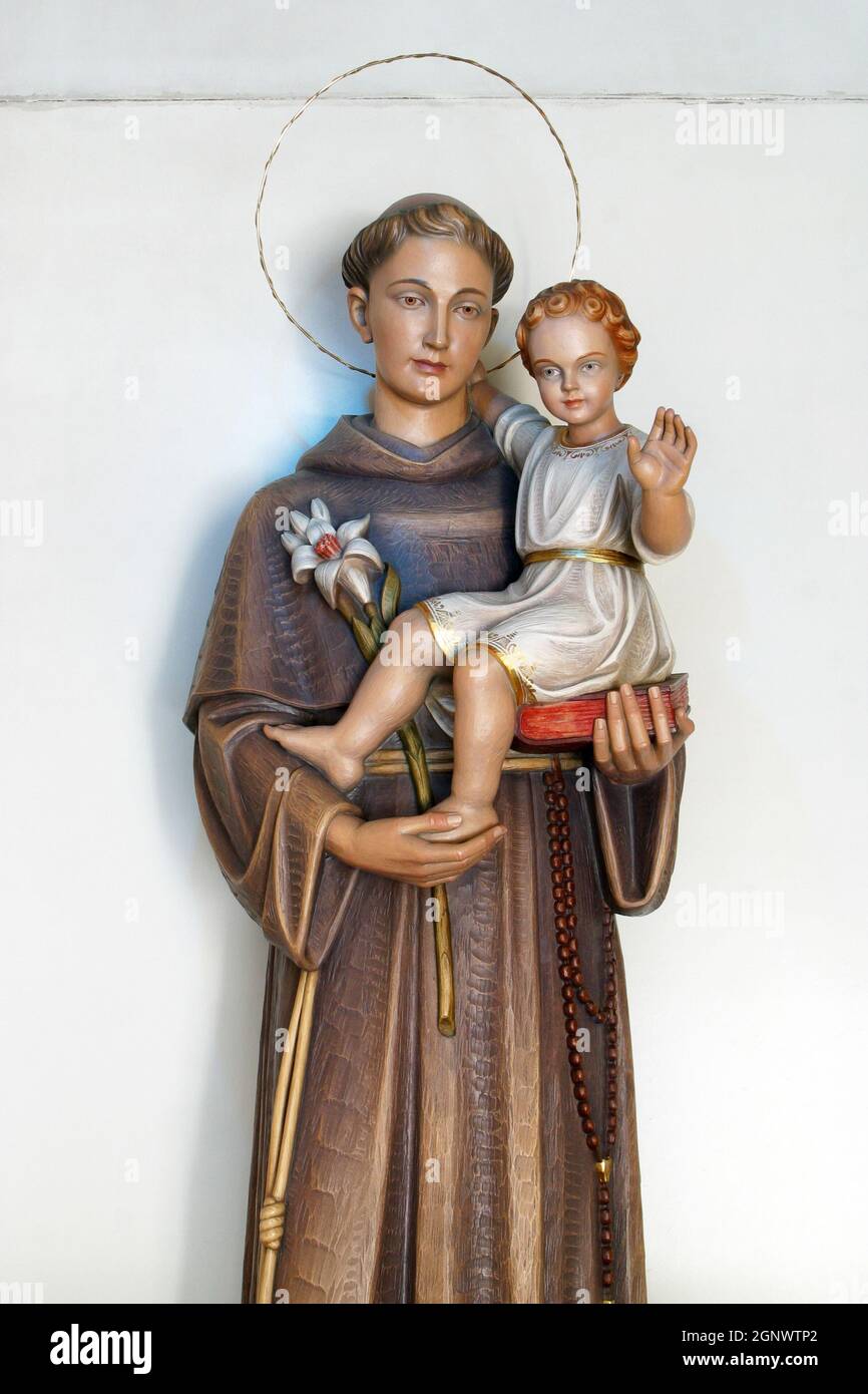 Saint Anthony holds a child of Jesus, a statue in the parish church of ...
