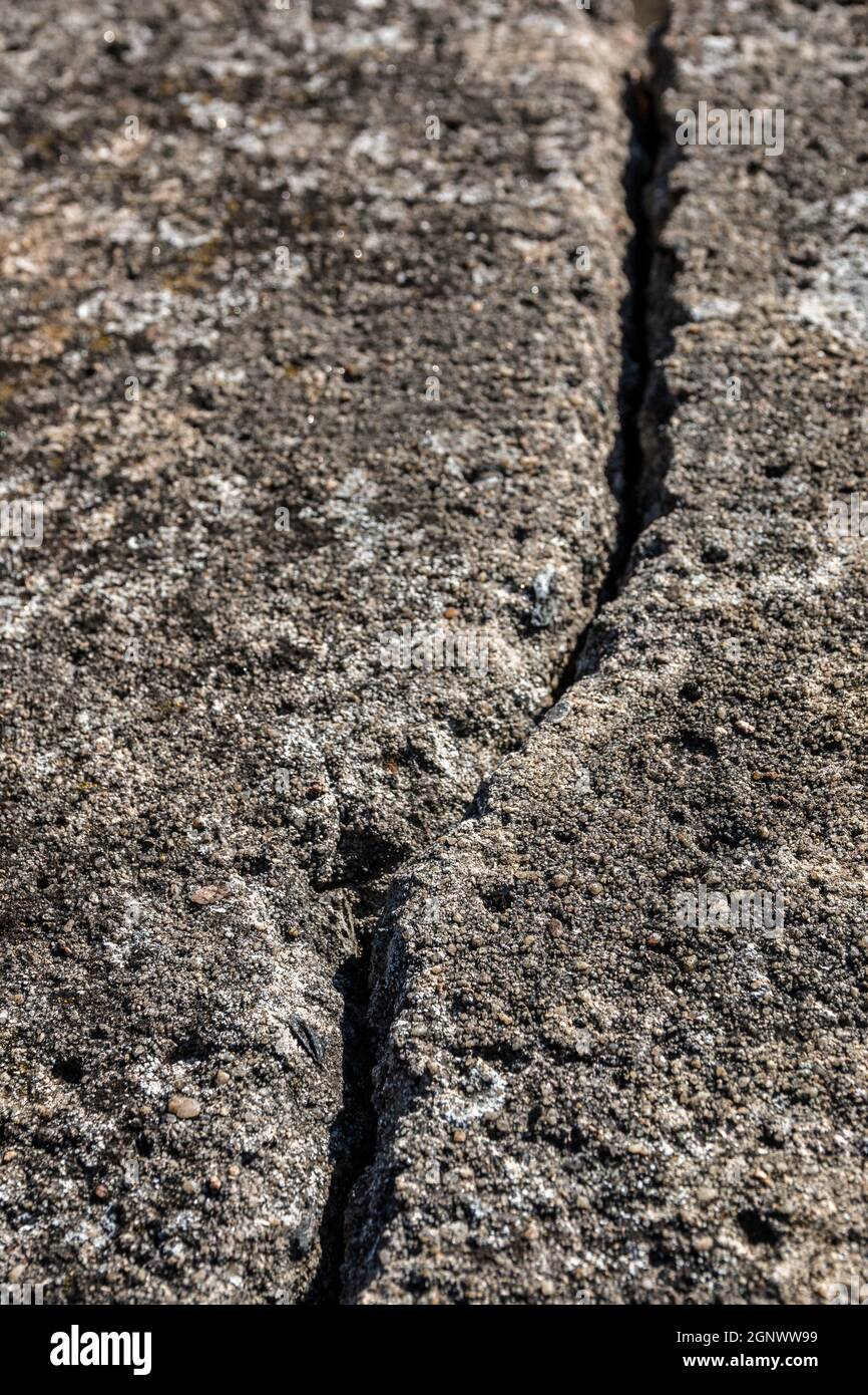 Deep crack in the big rock of the wall of a castle Stock Photo - Alamy
