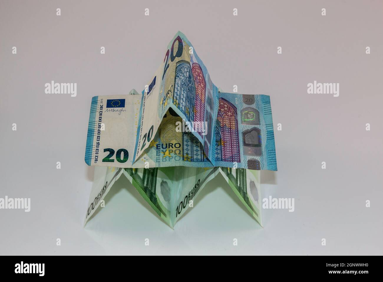 A tiny building made of different Euro banknotes Stock Photo - Alamy