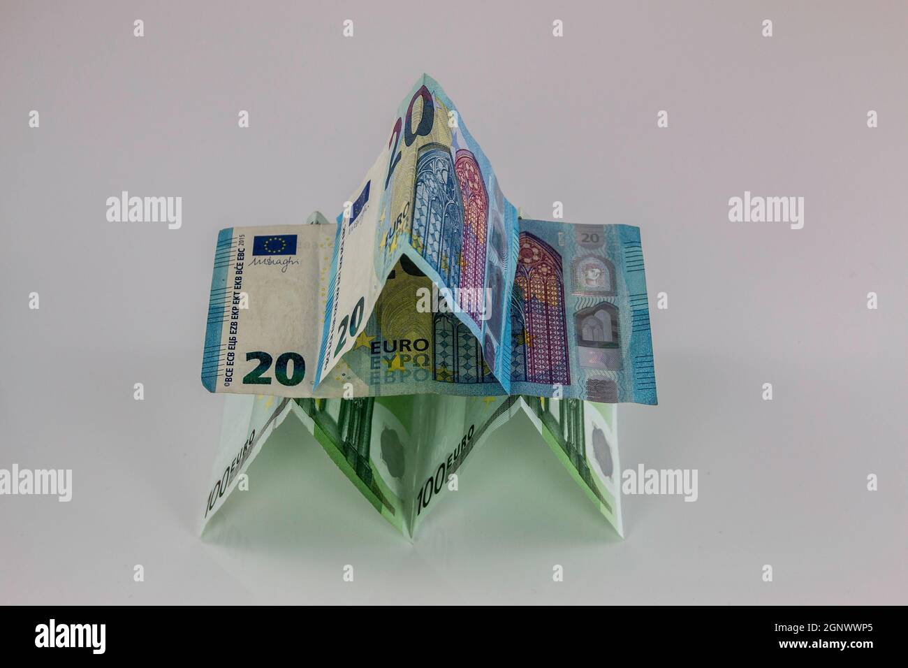 A tiny building made of different Euro banknotes Stock Photo - Alamy