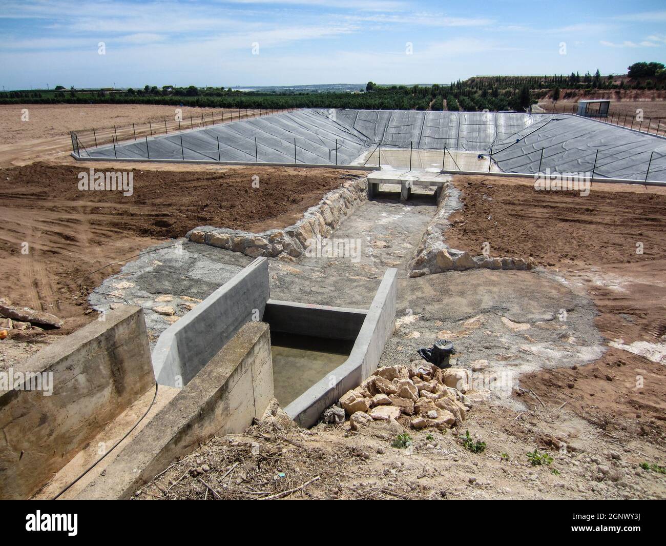 farm reservoir for field irrigation under construction on spanish ...