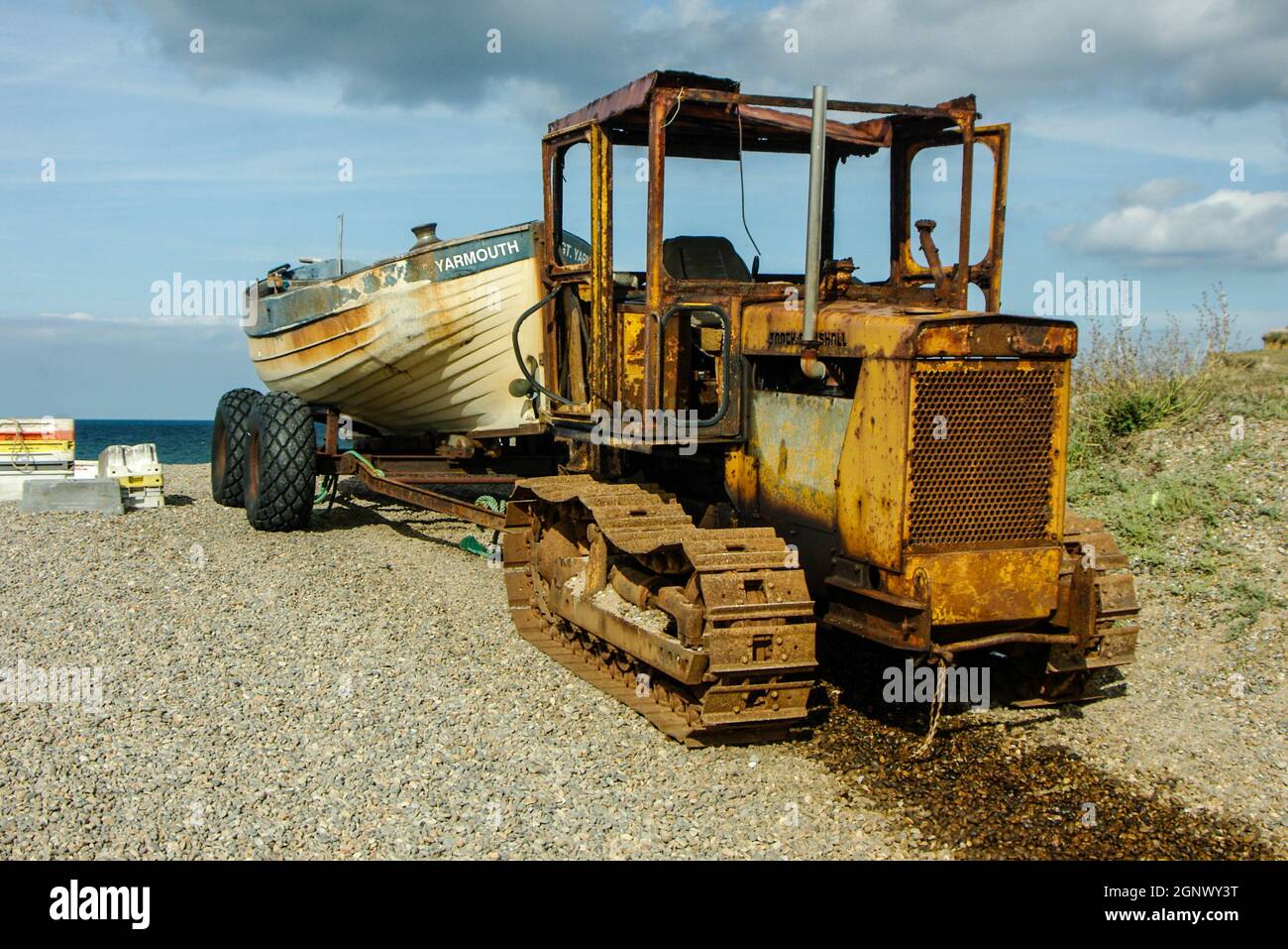 tractor towing a boat on a Norfokk beach Stock Photo - Alamy