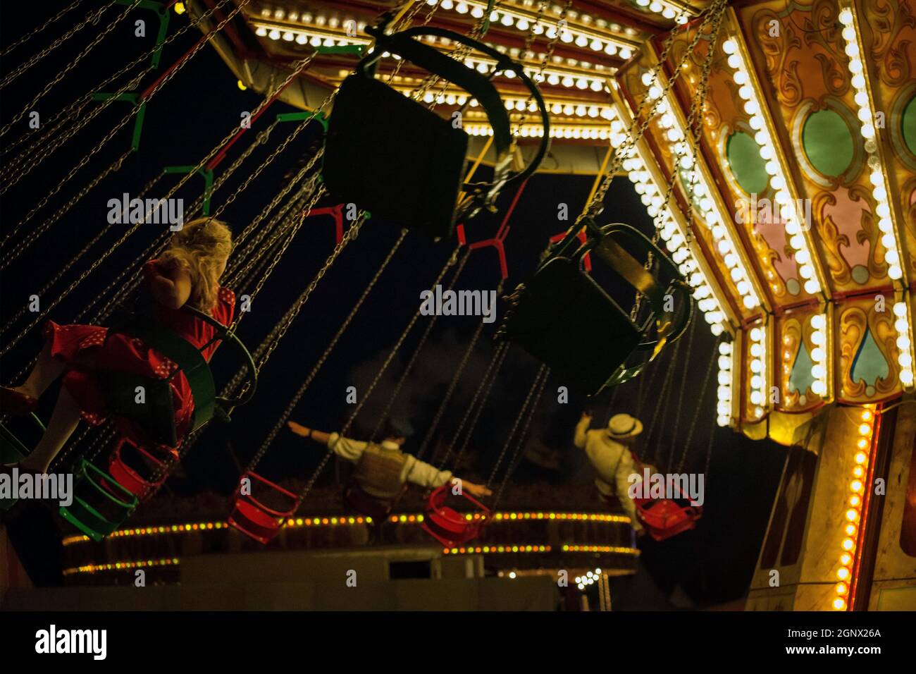 Fun Fair at festival night Stock Photo - Alamy