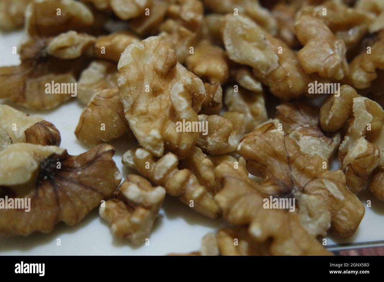 Close-up top view of peeled walnut on a white background. peeled walnut ...