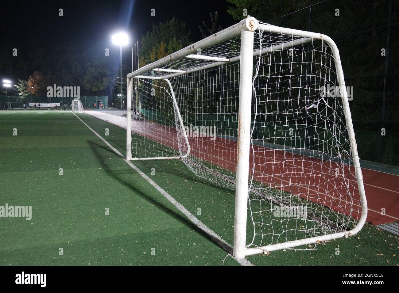 Football under lights at night hi-res stock photography and images - Alamy