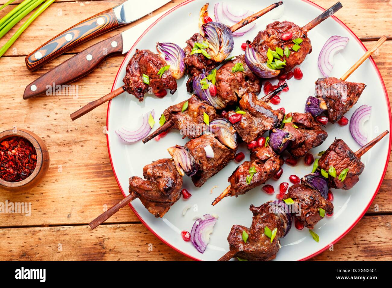 Grilled liver kebab with onion on wooden skewers Stock Photo - Alamy