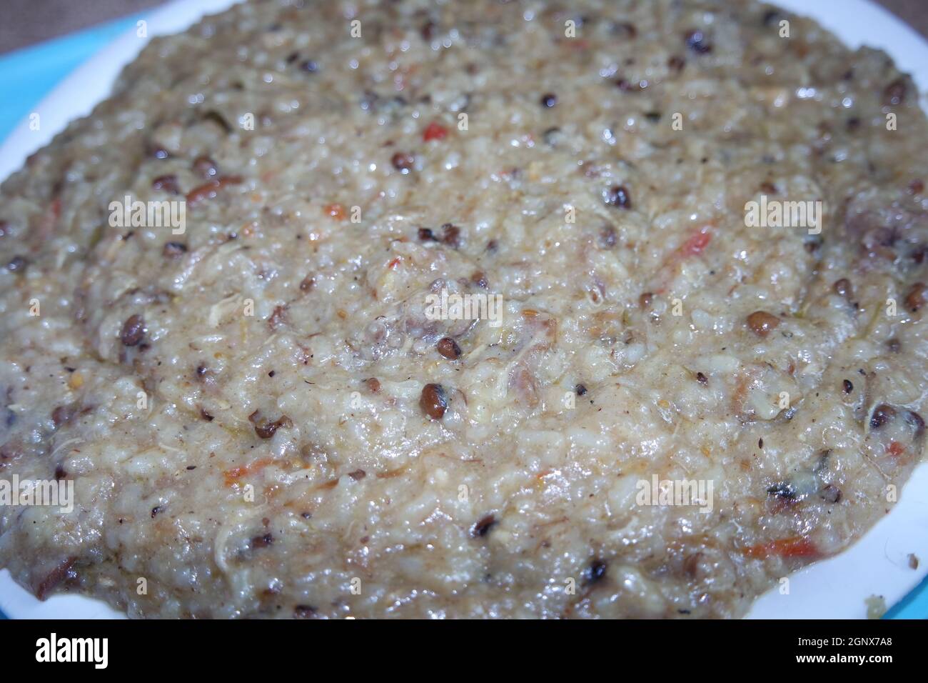 A close up view of Cooked white rice called Kichra served with green ...