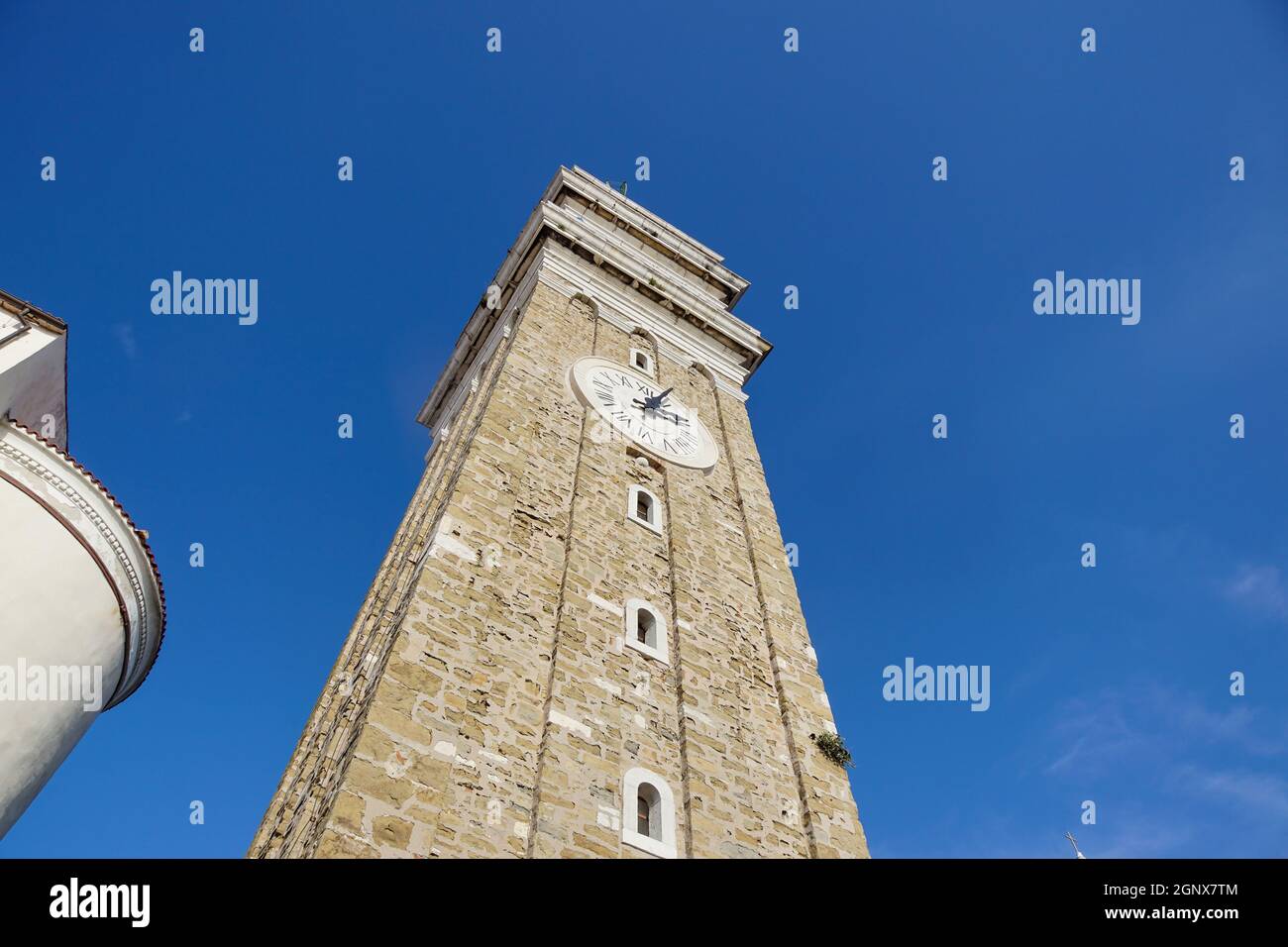 The clock tower with blue sky in italy . Medieval tower Stock Photo - Alamy
