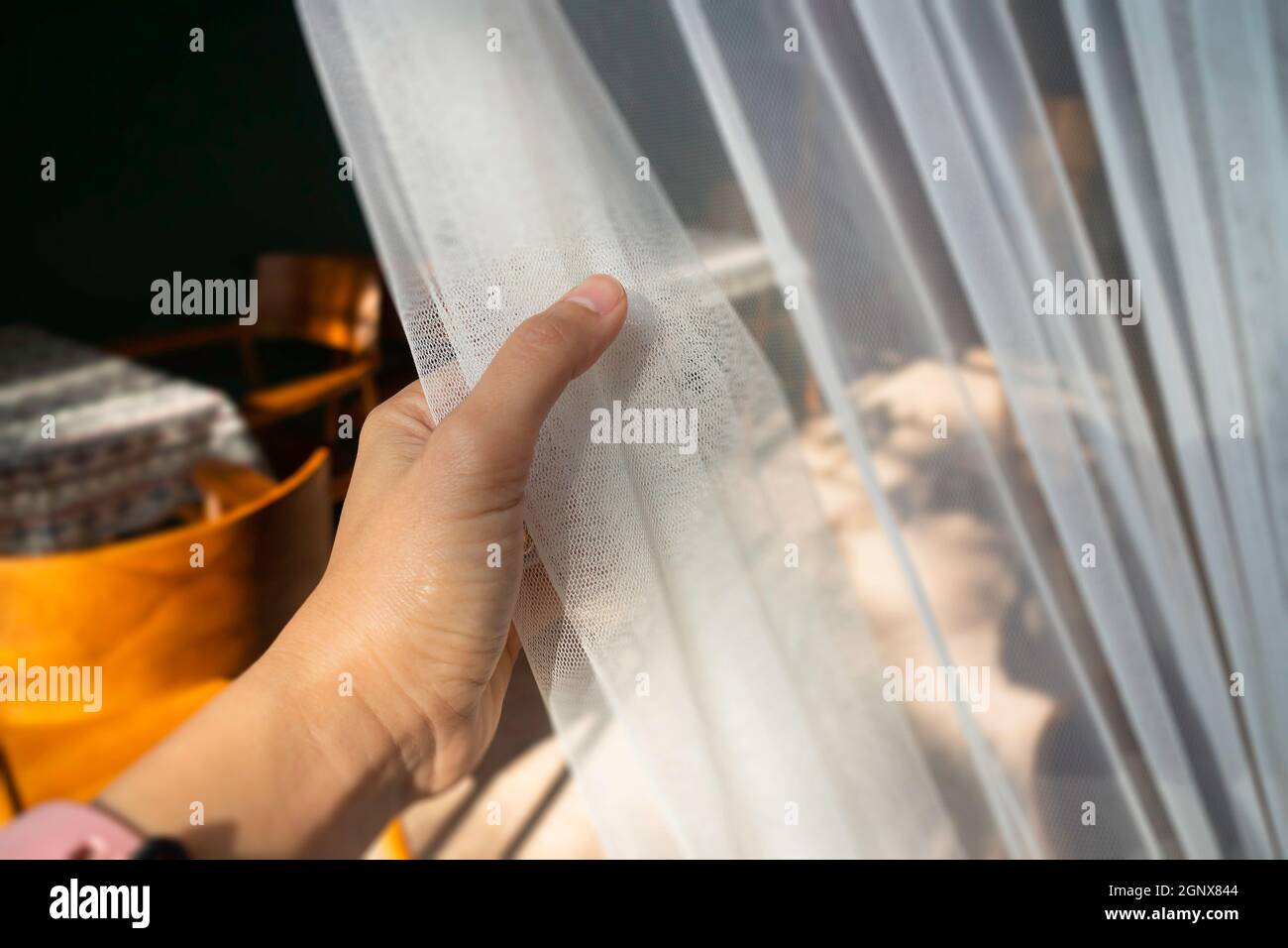 Hand opening curtain hi-res stock photography and images - Alamy