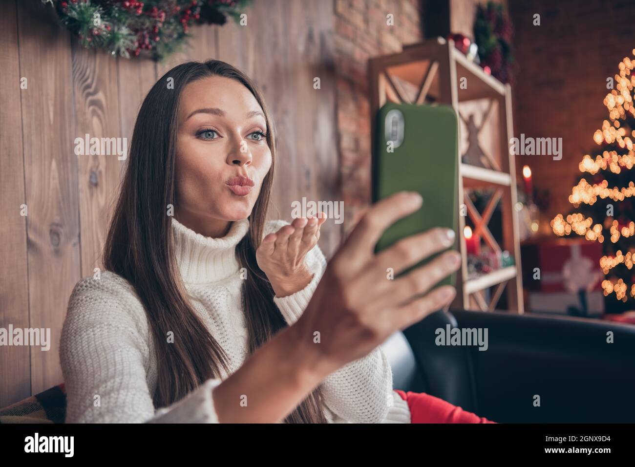 Photo of charming flirty young lady wear white pullover sending kiss ...