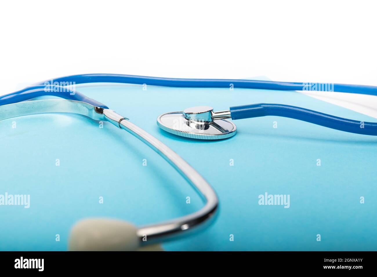 medical record and blue stethoscope close-up on white background in ...