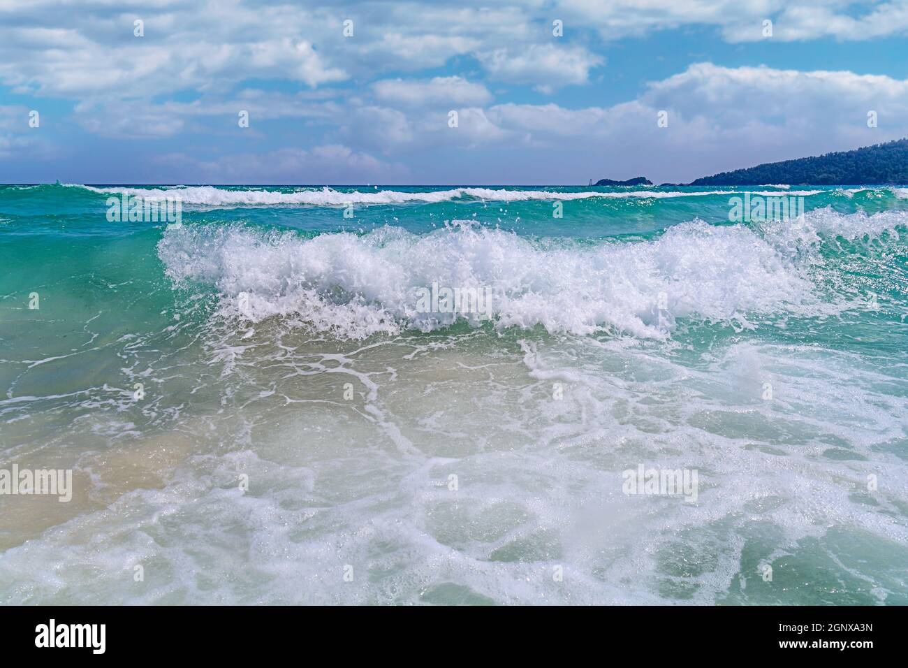 Big tropical green ocean wave with cloudy sky background Stock Photo ...