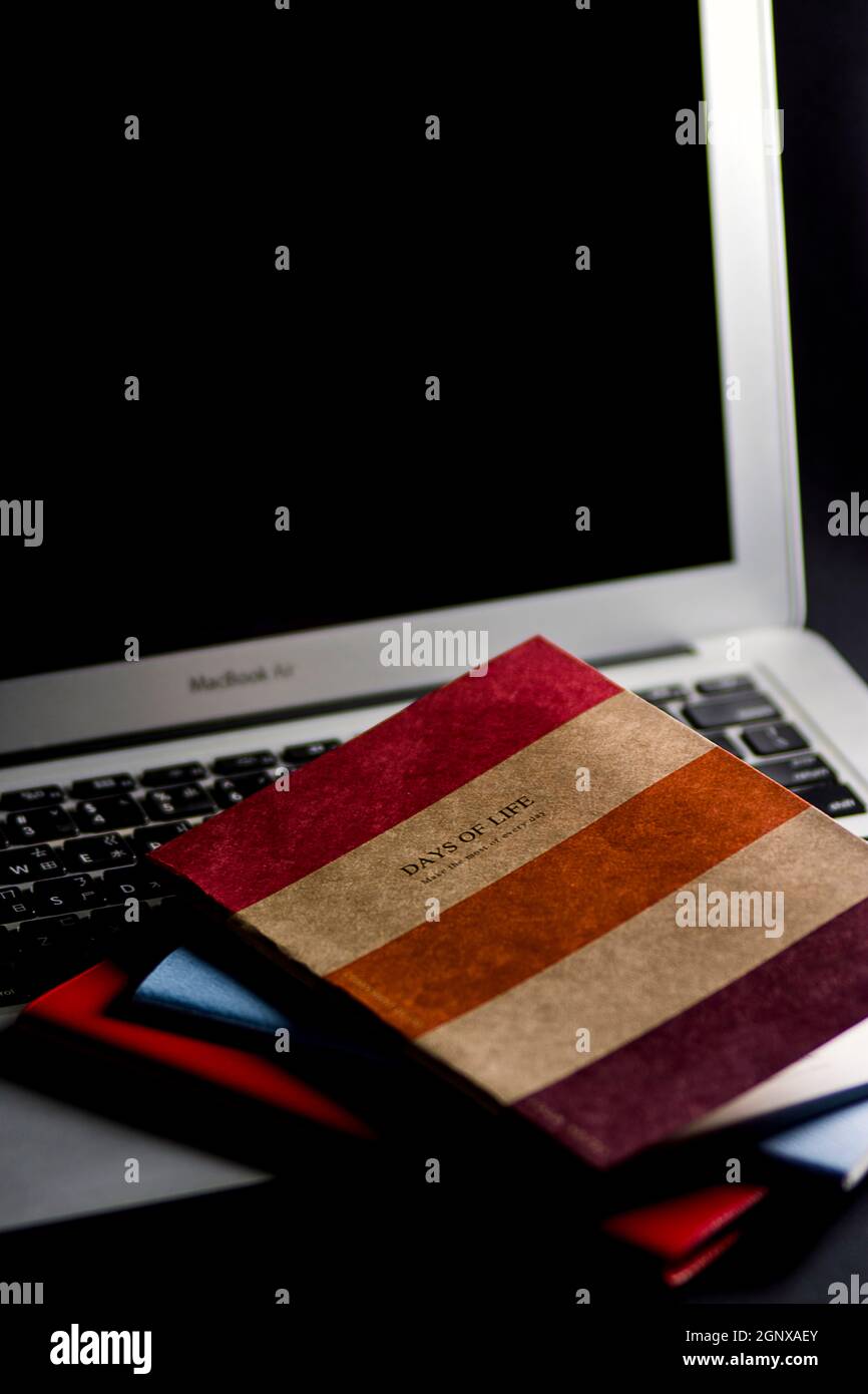 Days of life - laptop and book Stock Photo - Alamy
