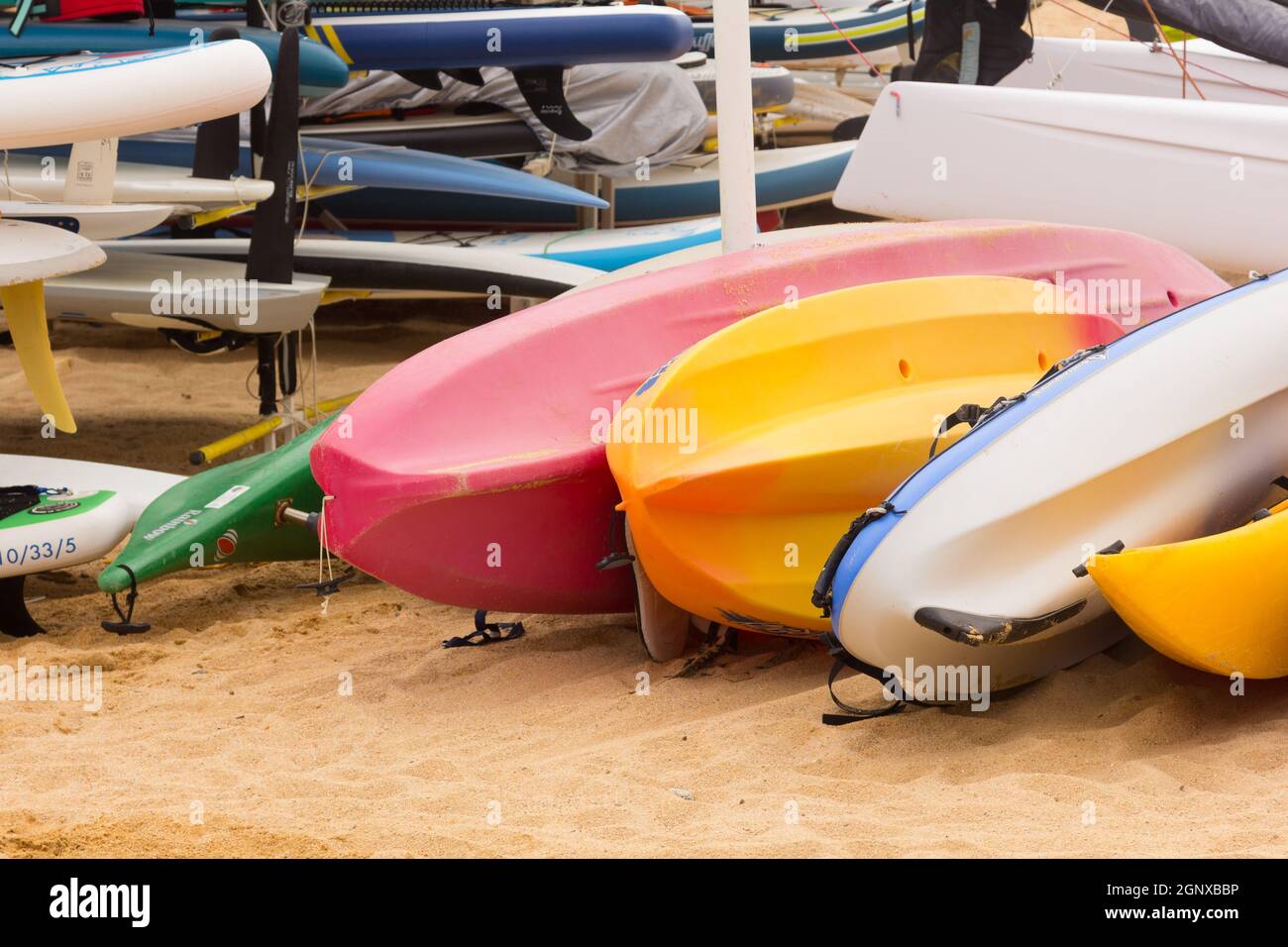 Colorful canoes on the beach sand Stock Photo - Alamy