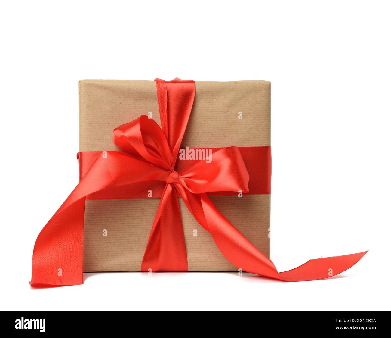 square box wrapped in brown kraft paper and tied with a red silk ribbon ...