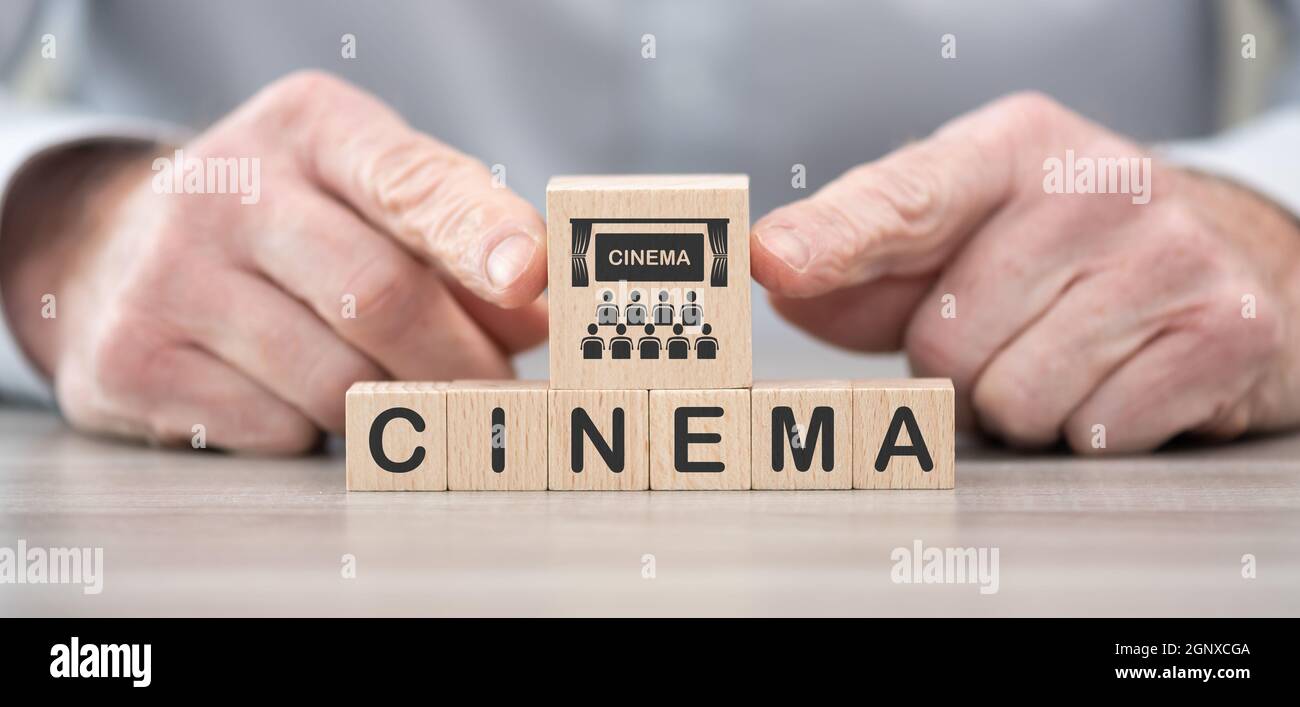 Wooden blocks with symbol of cinema concept Stock Photo - Alamy
