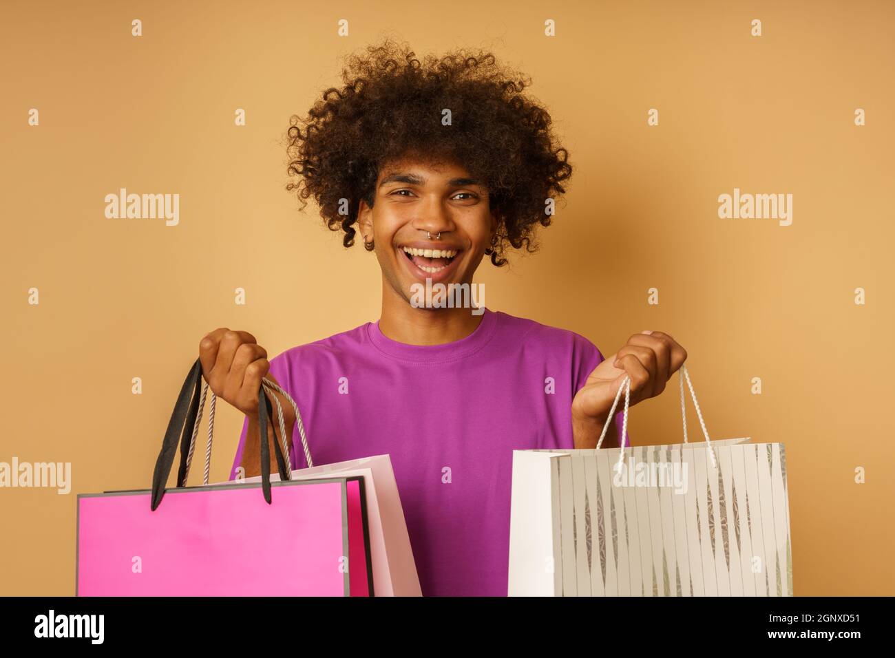 Happy man is happy to buy from shops Stock Photo - Alamy