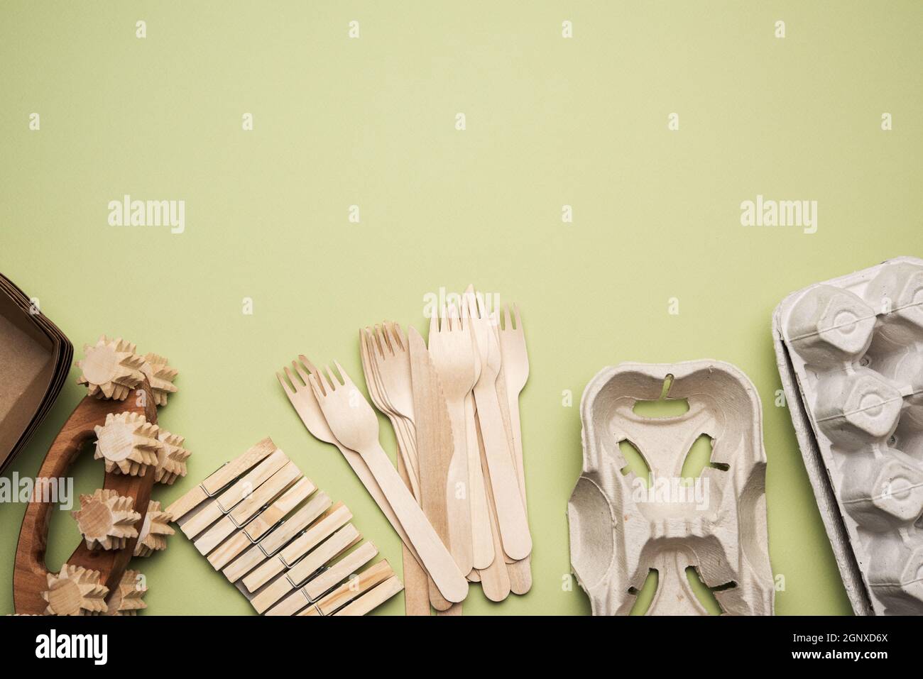 various household items from recyclable raw materials on a green ...