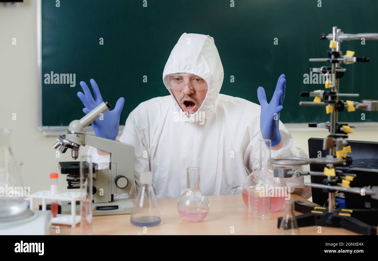 A scientist in a chemical laboratory is disappointed with a failed ...