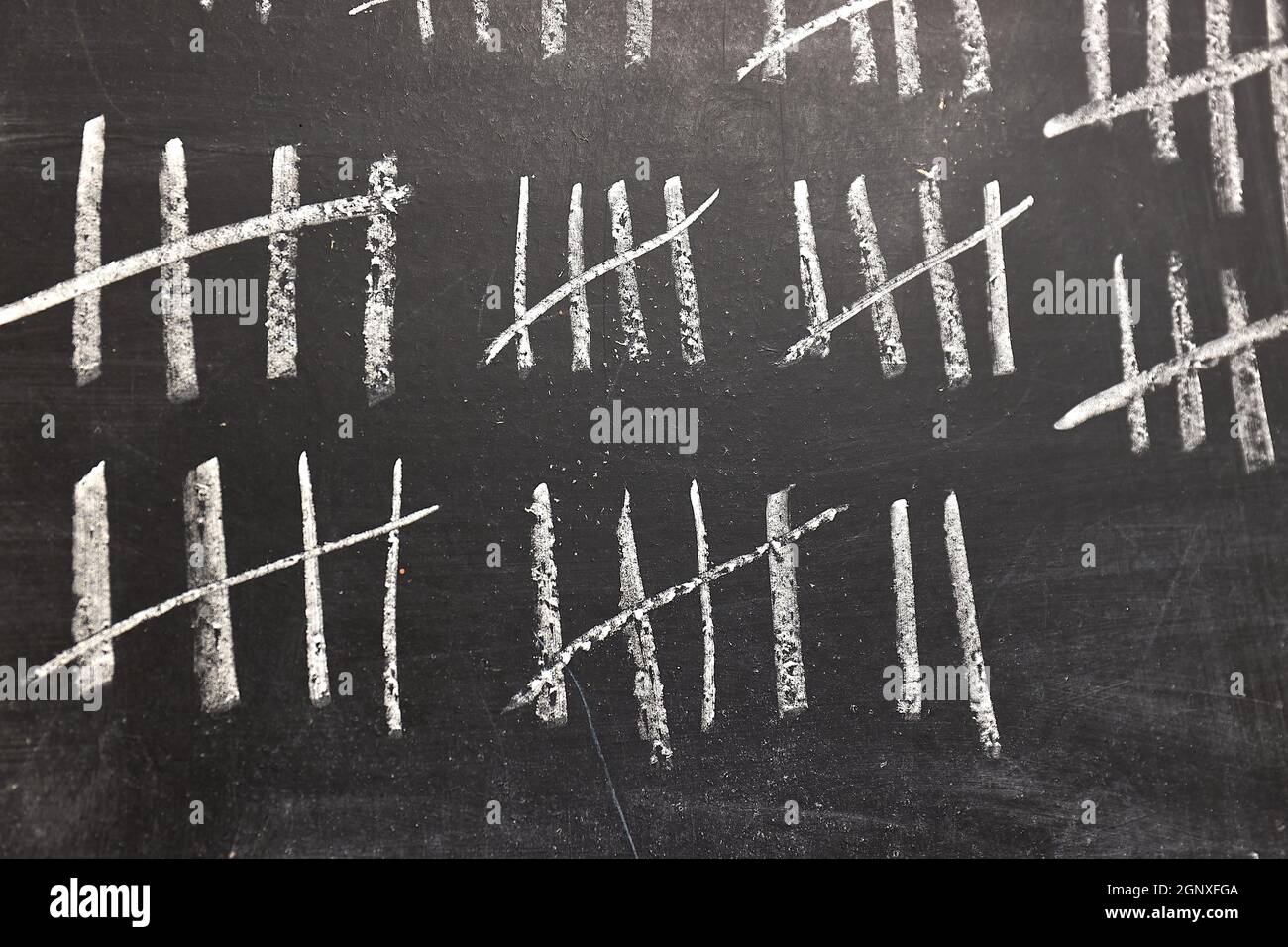 Drawing counting tally chart with chalk, marks in groups of five ... Drawing counting tally chart with chalk, marks in groups of five ...